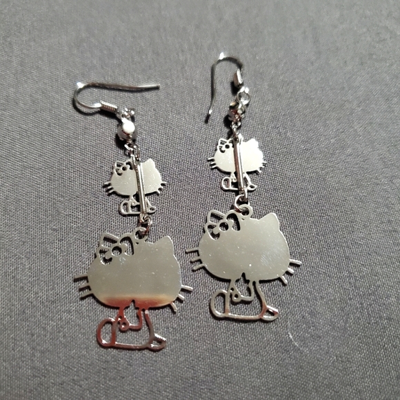 Hello Kitty | Jewelry | Silver Tone Hello Kitty Designbrand Logo Dangle ...